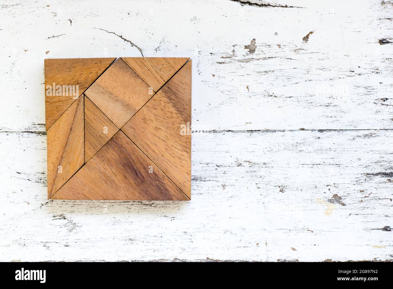 Tangram puzzle in square shape on old white wood background Stock Photo ...