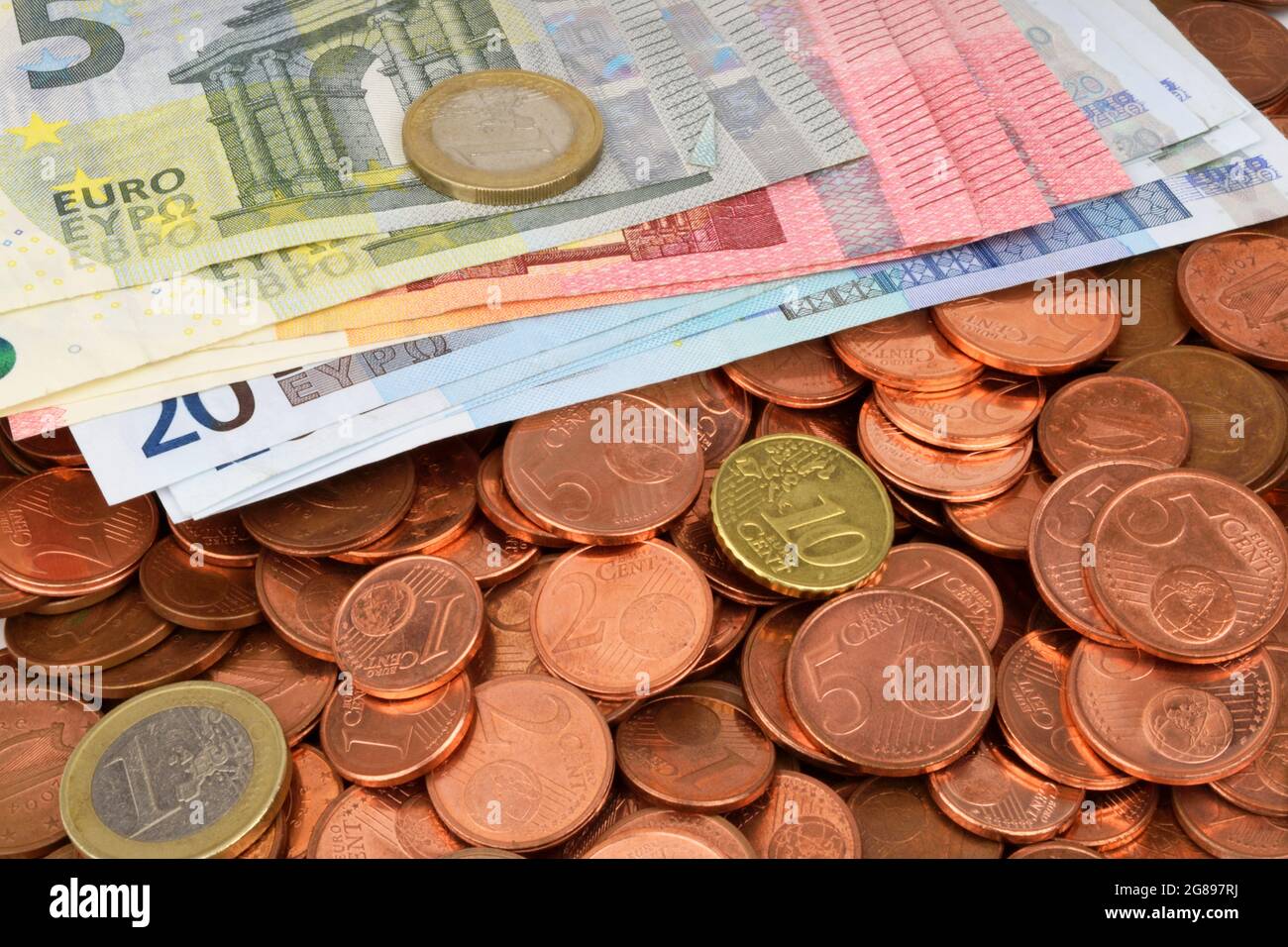 A photograph of Euro bank notes and coins Stock Photo - Alamy
