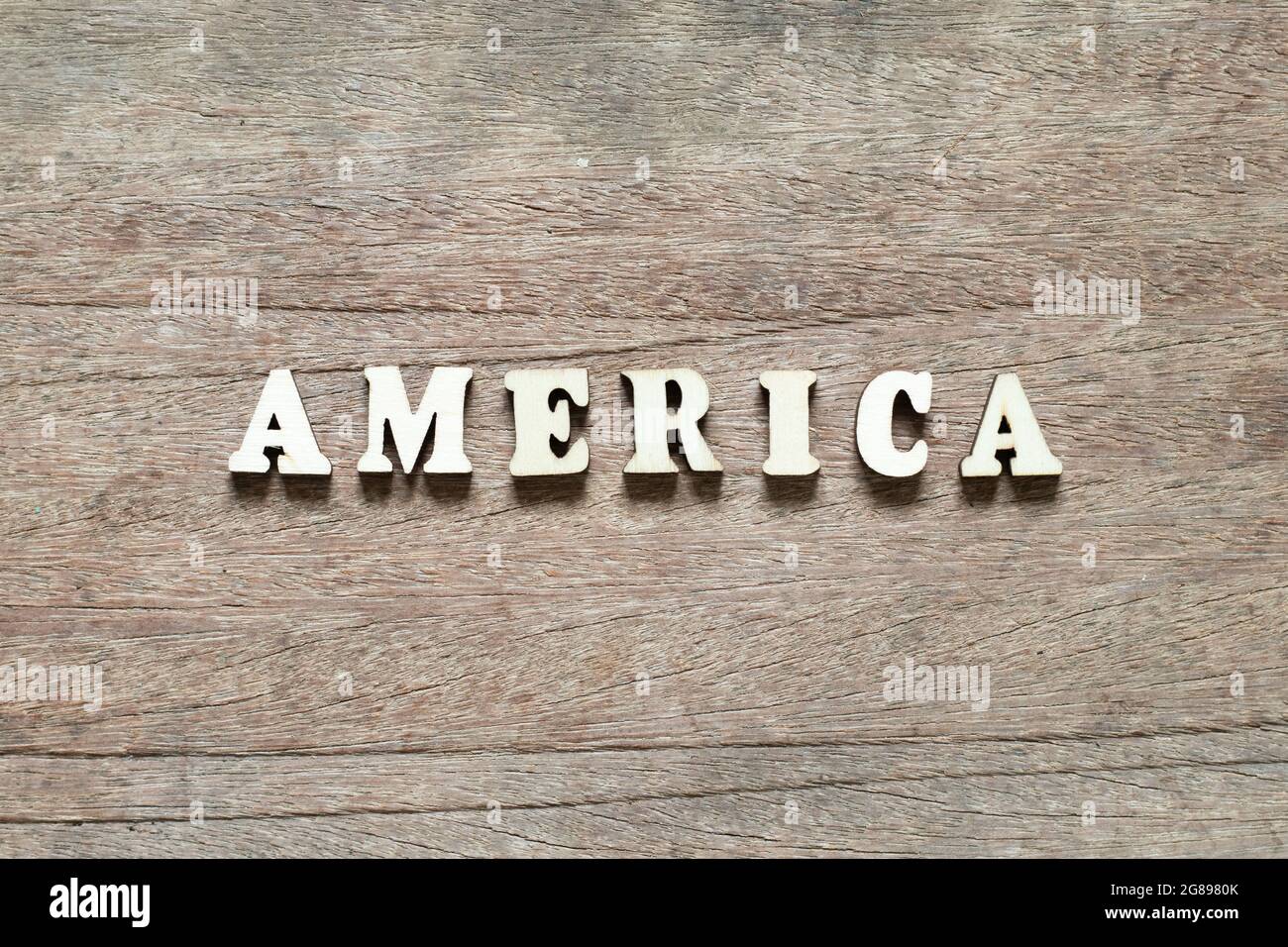 Letter block in word america on wood background Stock Photo - Alamy
