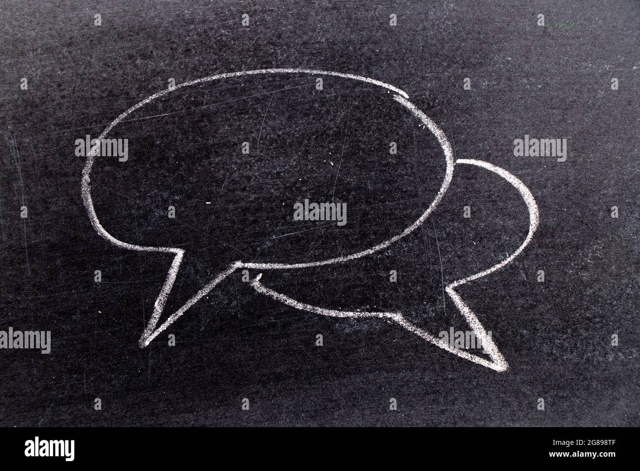 White chalk hand drawing in bubble speech shape with blank space for ...