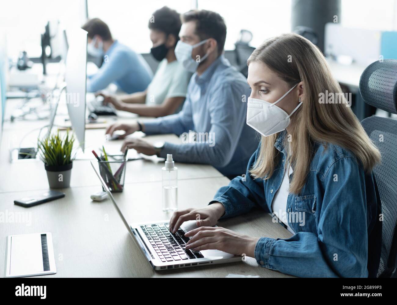 Group of business people wear protective face mask working in office ...