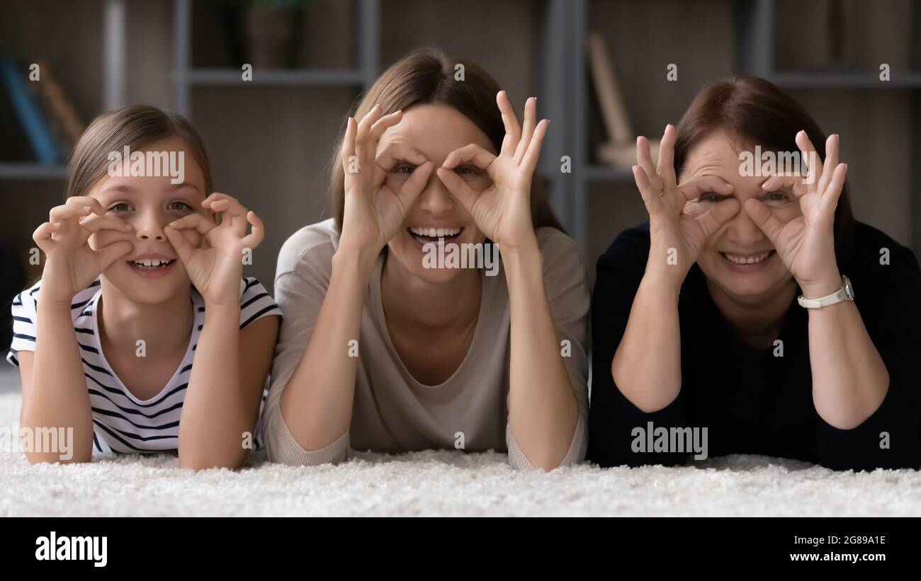 Happy daughter girl, mom, grandma having fun at home together Stock ...