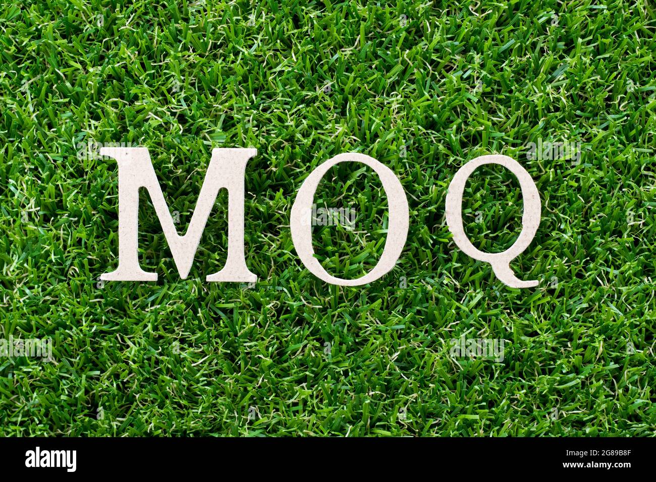 Wood letter in word MOQ (Abbreviation of Minimum Order Quantity) on ...
