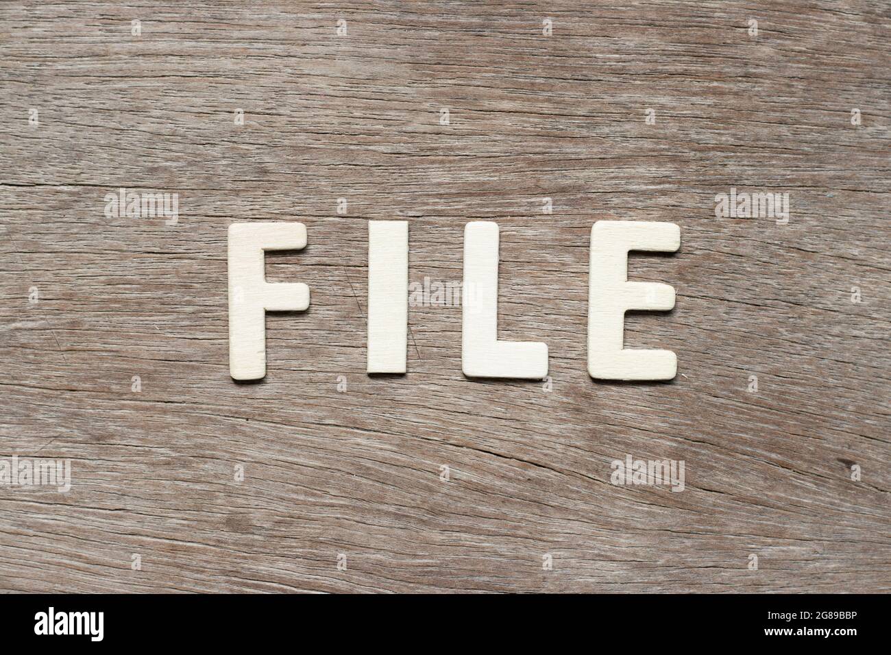 Alphabet letter in word file on wood background Stock Photo - Alamy
