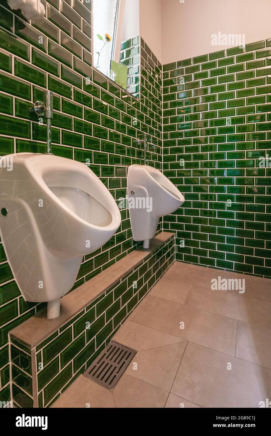 Glance into an extraordinary guest toilet. with two urinals. The small ...