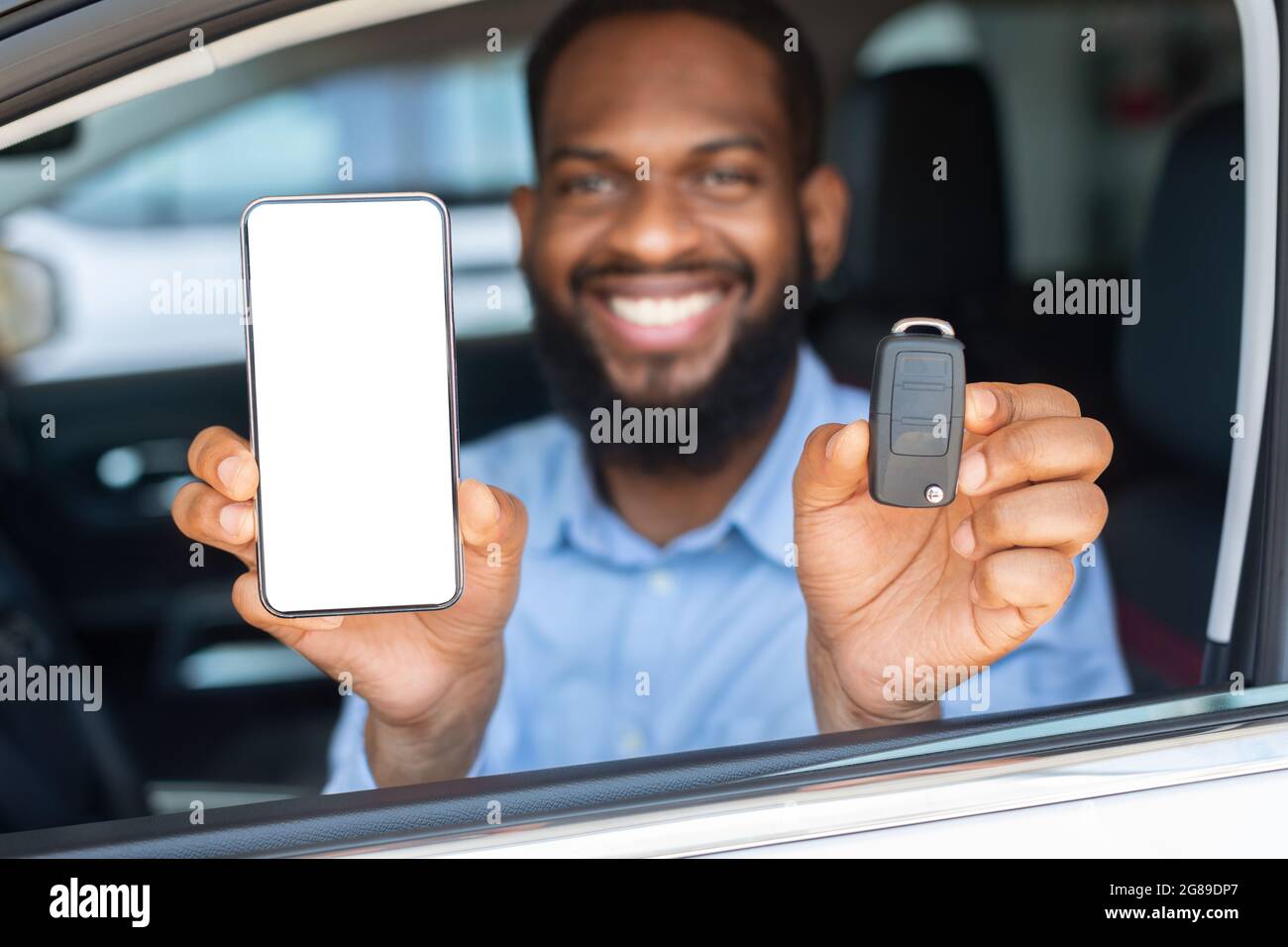 Car Renting App. Black Man Showing Key And Smartphone With Blank Screen ...