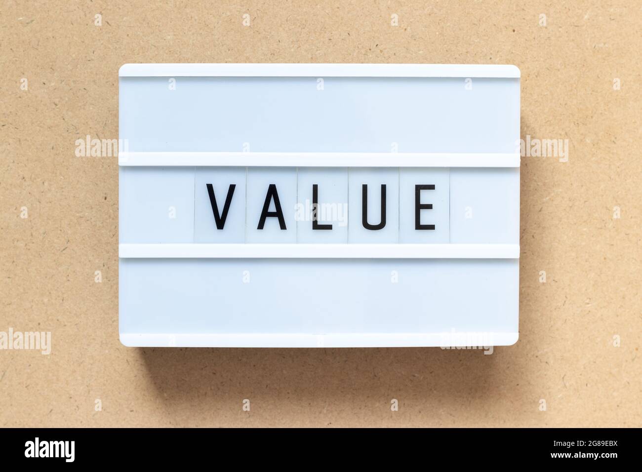 White lightbox with word value on wood background Stock Photo - Alamy