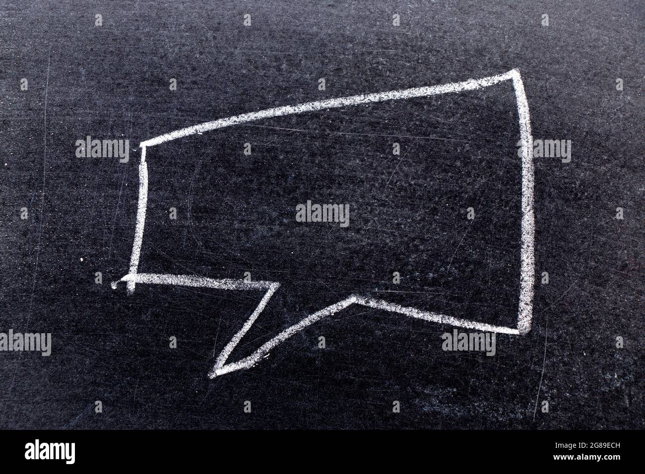 White chalk hand drawing in bubble speech shape with blank space for ...