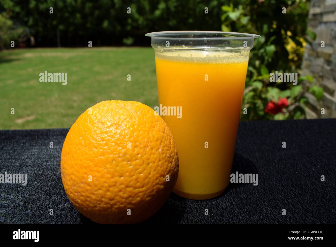 Citrus Malta juice served in transparent glass with Malta fruit on ...