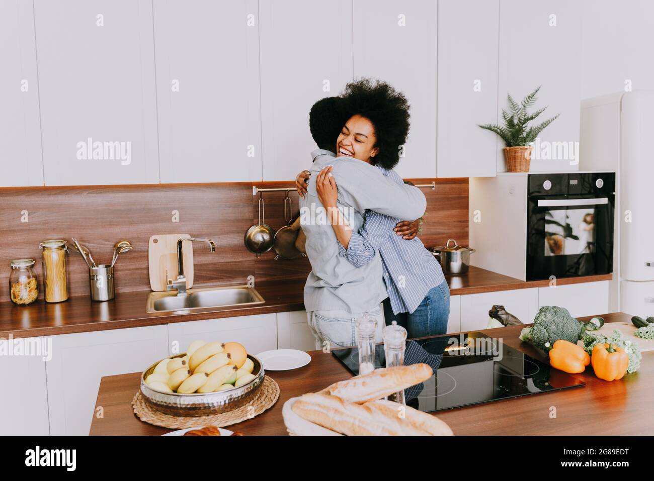 Beautiful afro american couple cooking at home - Beautiful and cheerful ...