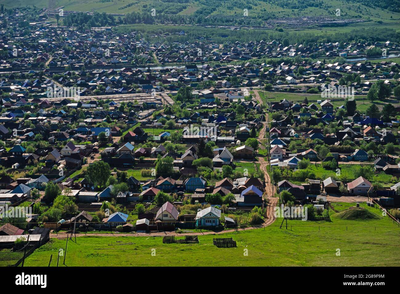 Aerial view of residential rural neighborhood area. House roofs. Russia ...