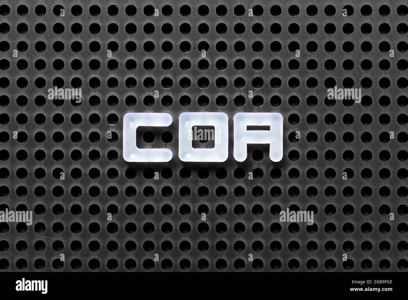Black color pegboard with white letter in word COA (abbreviation of ...