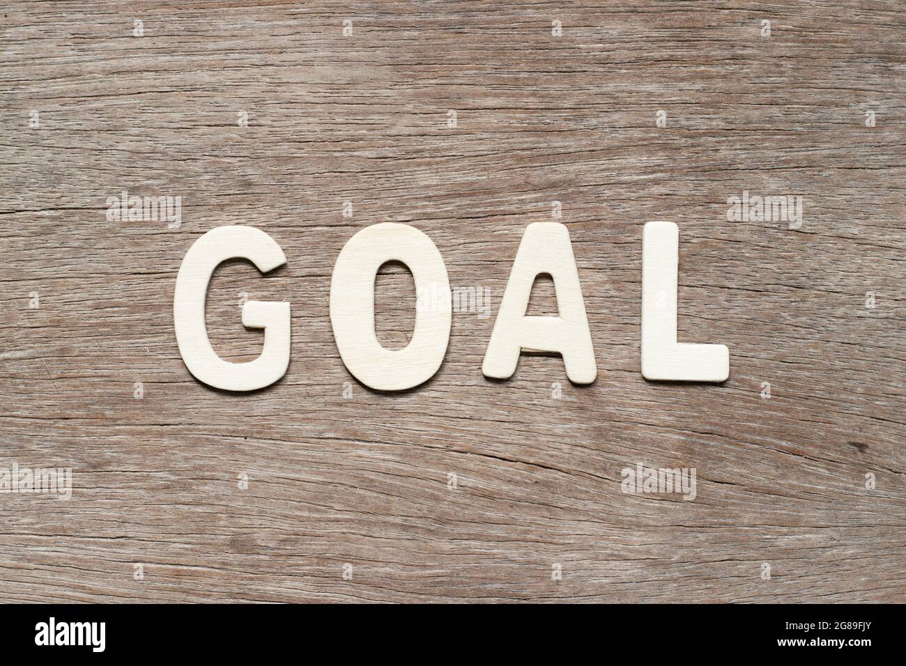 Alphabet letter in word goal on wood background Stock Photo - Alamy