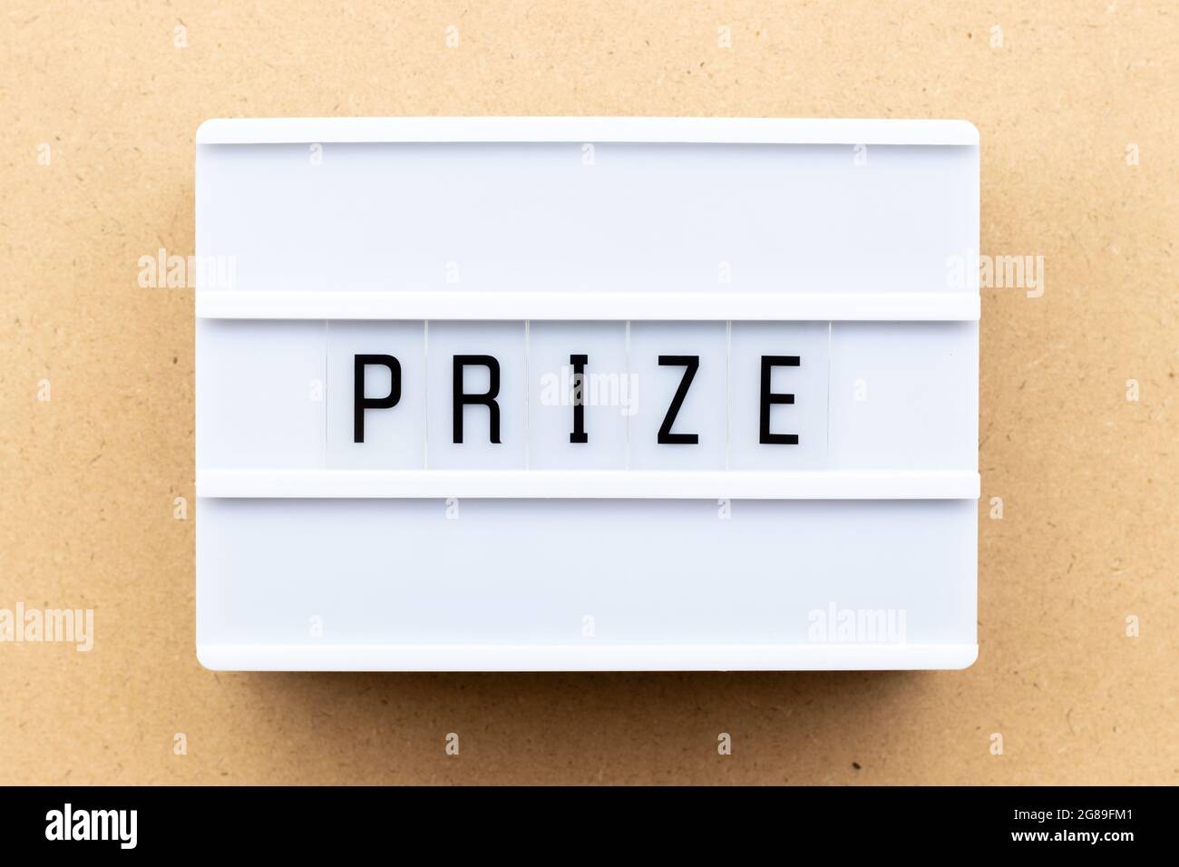 Light box with word prize on wood background Stock Photo - Alamy
