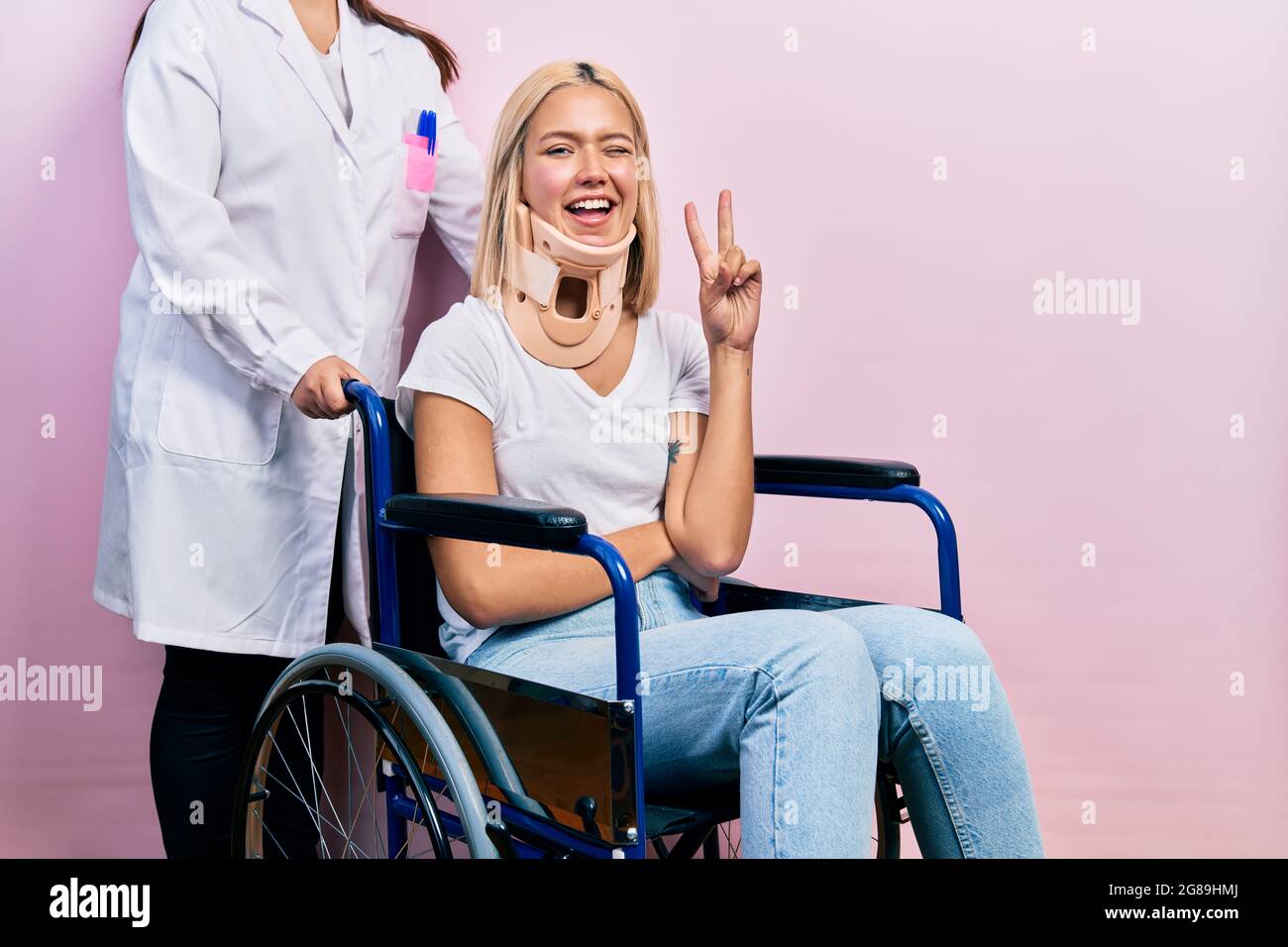 Beautiful blonde woman sitting on wheelchair with collar neck smiling ...