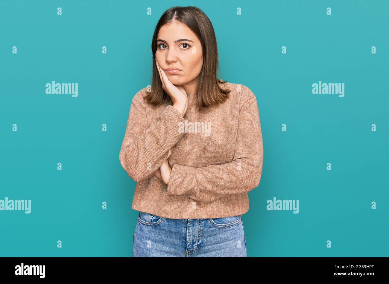 Young beautiful woman wearing casual clothes thinking looking tired and ...