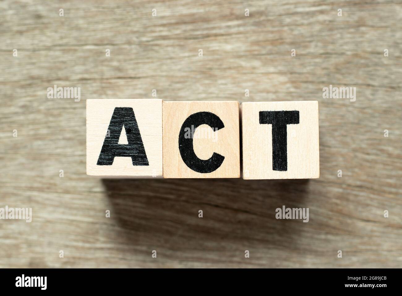 Letter block in word act on wood background Stock Photo - Alamy