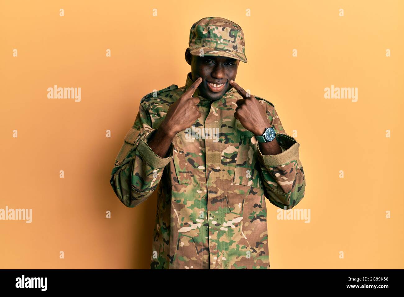 Young african american man wearing army uniform smiling with open mouth ...