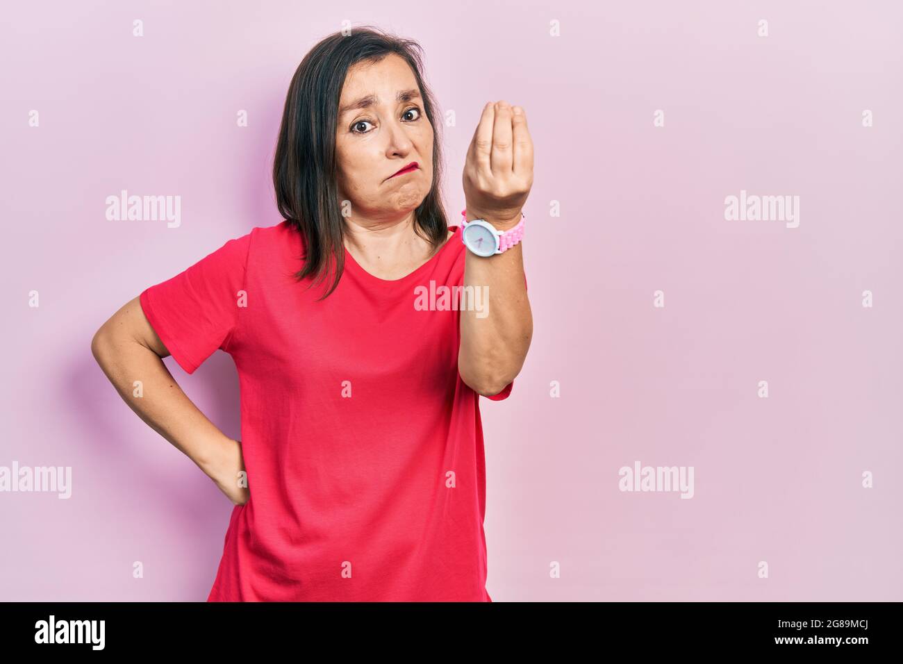 Middle age hispanic woman wearing casual clothes doing italian gesture ...