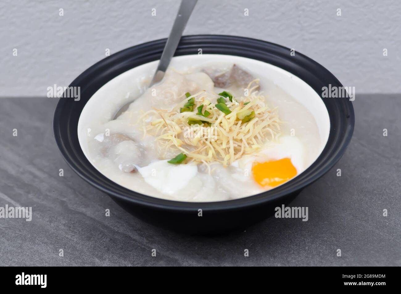 rice gruel, rice porridge or congee with pork liver and egg and ...