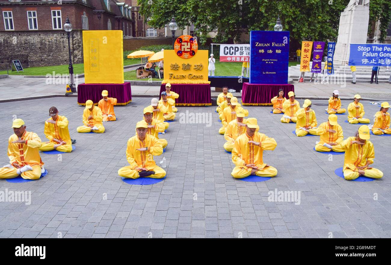 London, United Kingdom. 18th July 2021. Falun Gong practitioners and ...