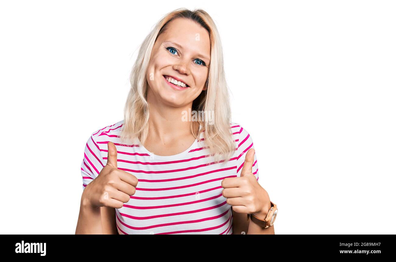 Young caucasian woman wearing casual clothes success sign doing ...