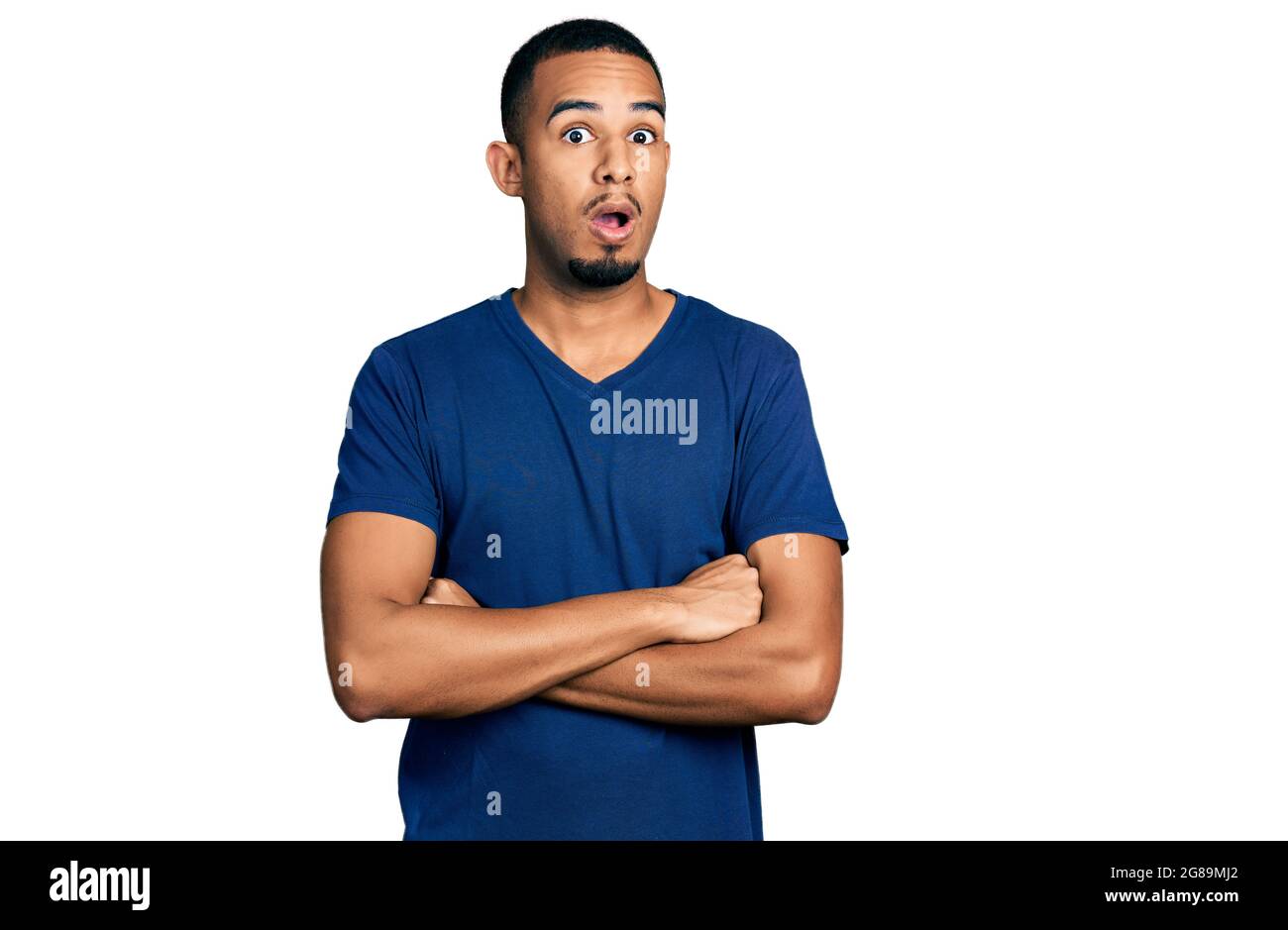 Young african american man with arms crossed gesture afraid and shocked ...
