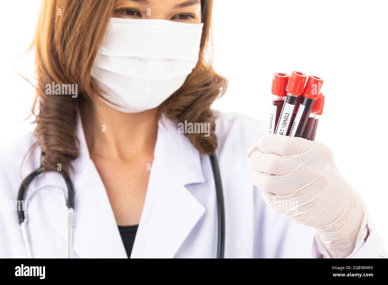 Woman in doctor gown or lab coat with stethoscope holding set of sample ...