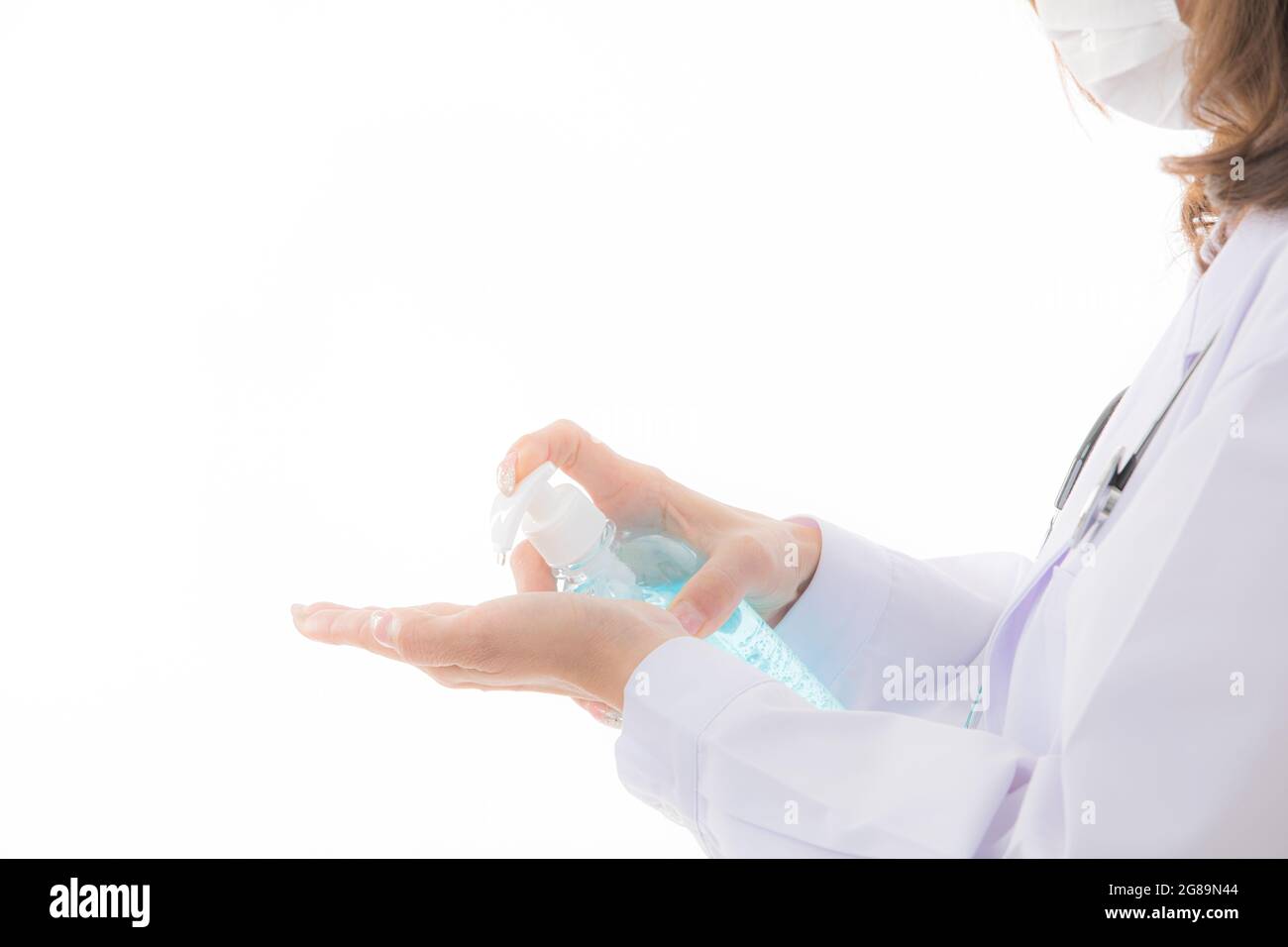 Doctor holding and pressing apply drop cleaning alcohol gel to wash ...