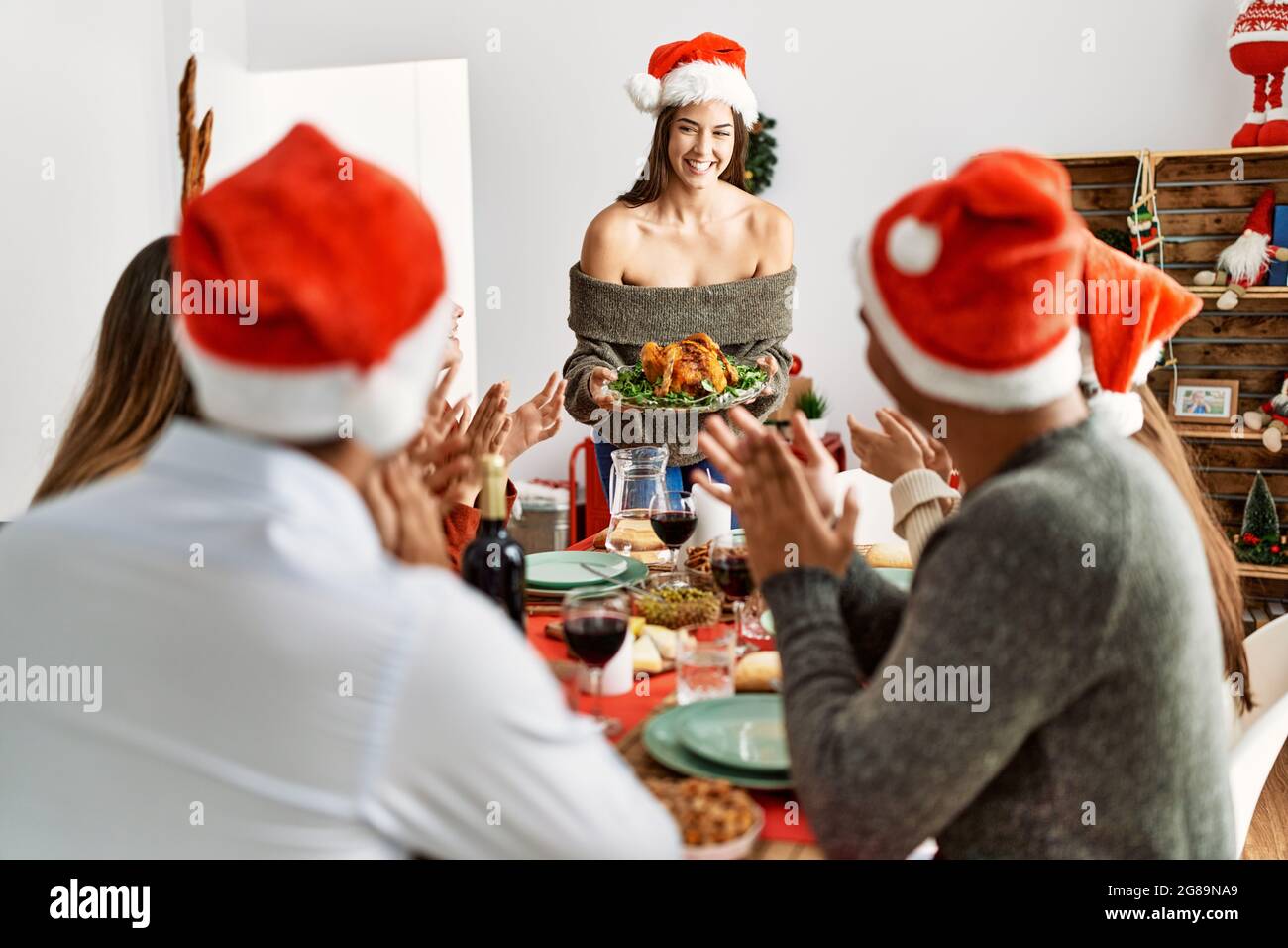 Group of people meeting clapping and sitting on the table. Woman ...