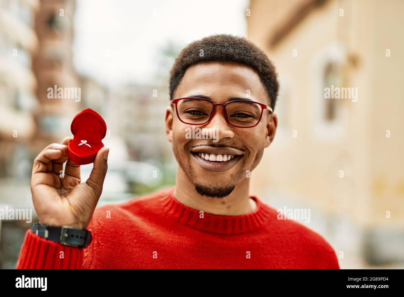 Handsome african american young man holding engagement ring Stock Photo ...