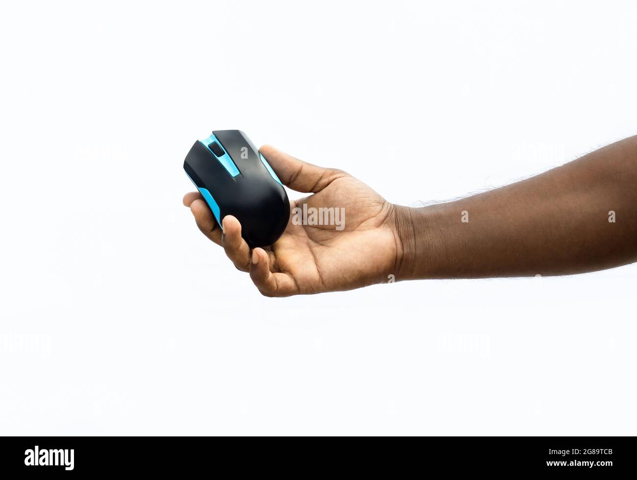 Wireless computer mouse in the hand on the isolated white background ...