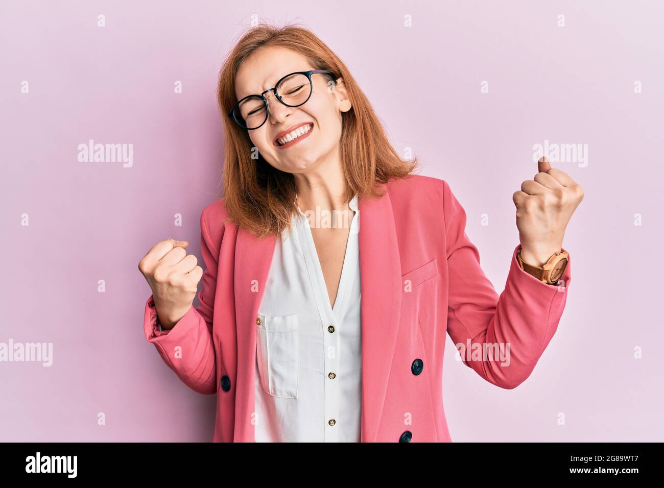 Young caucasian woman wearing business style and glasses very happy and ...
