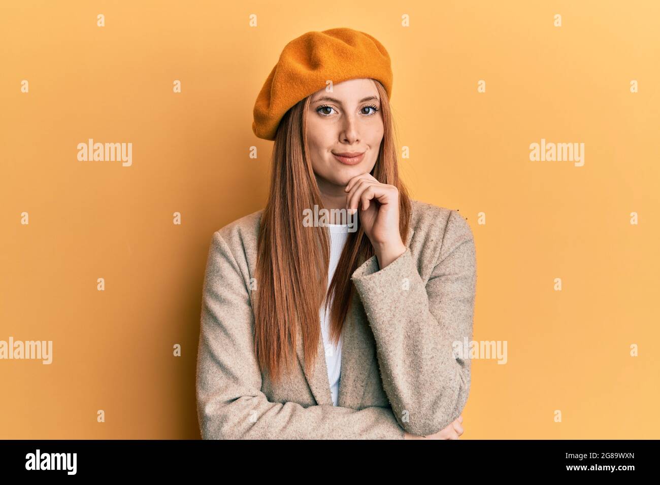 Young irish woman wearing french look with beret serious face thinking ...