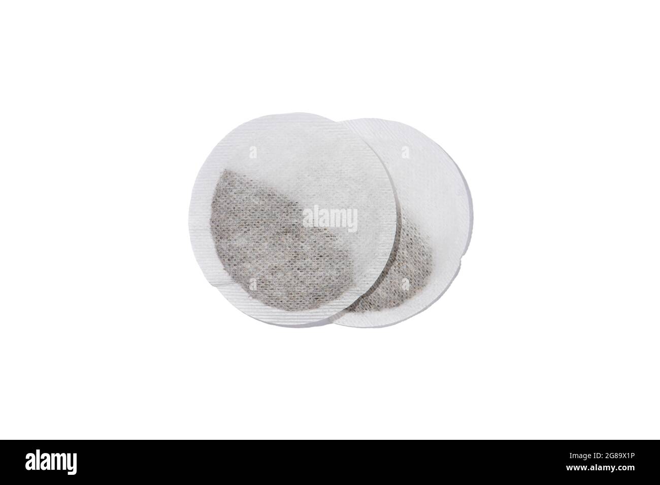 Group of two round tea bags isolated on white background. Top view ...