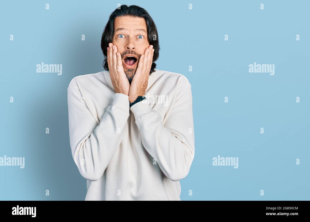 Middle age caucasian man wearing casual clothes afraid and shocked ...