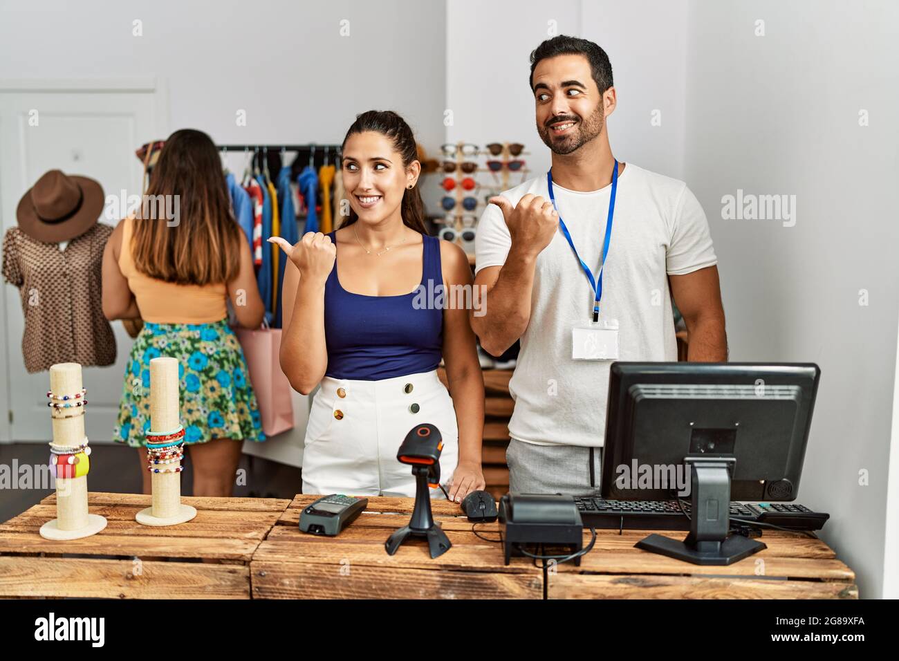 Group of young hispanic people working as manager at retail boutique ...