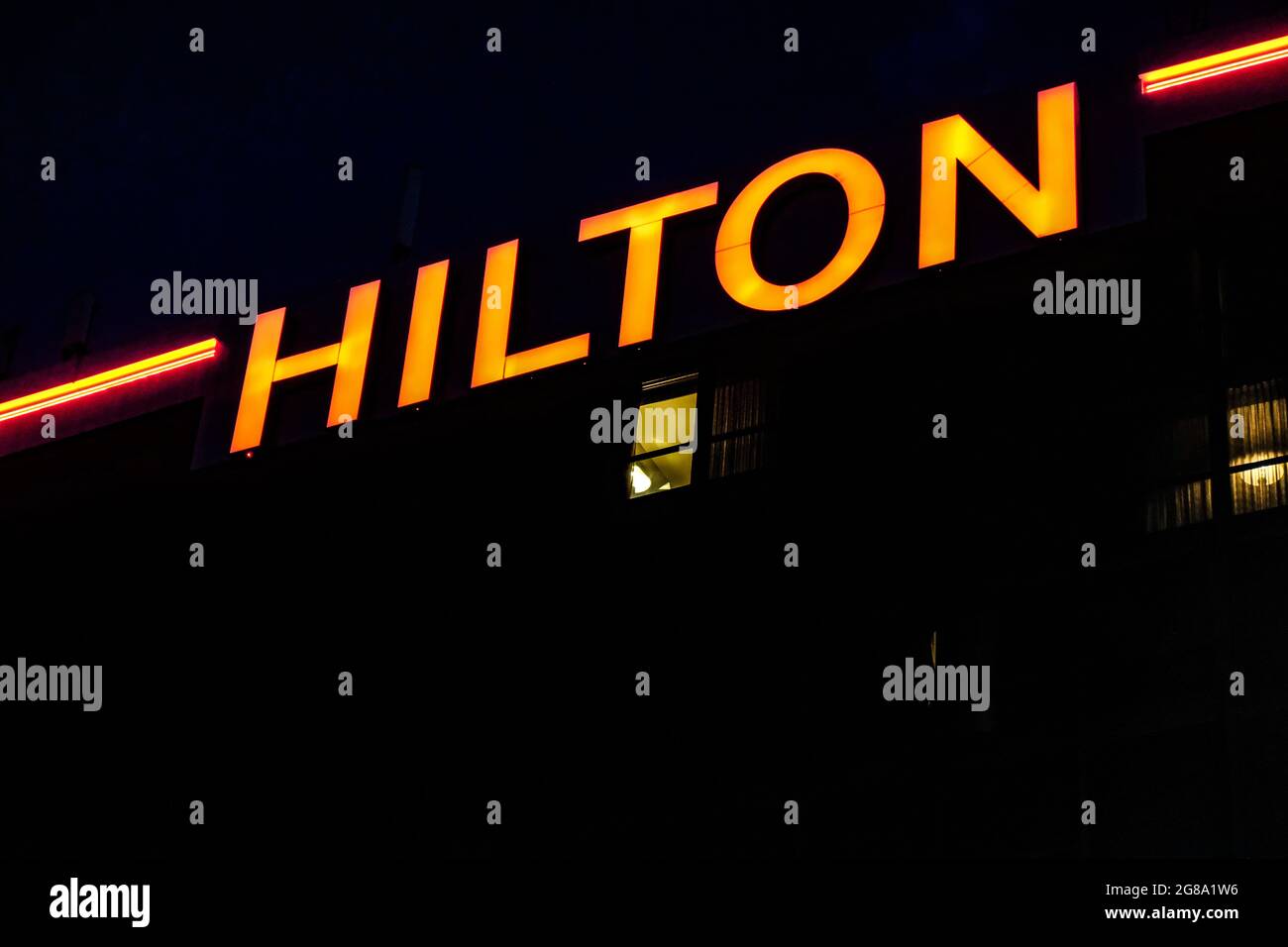 Night view of the Hilton logo on a sign on the Hilton at Chicago's O ...