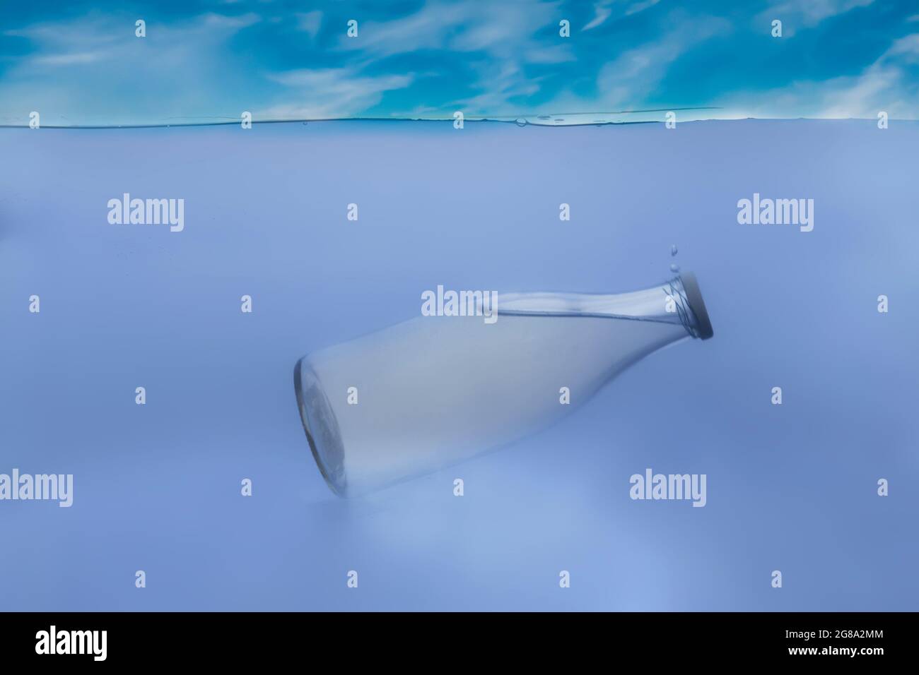 the transparent glass bottle underwater in ocean Stock Photo - Alamy