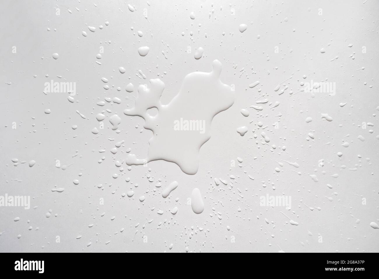water splash lit on the white table surface, abstract raindrops Stock ...