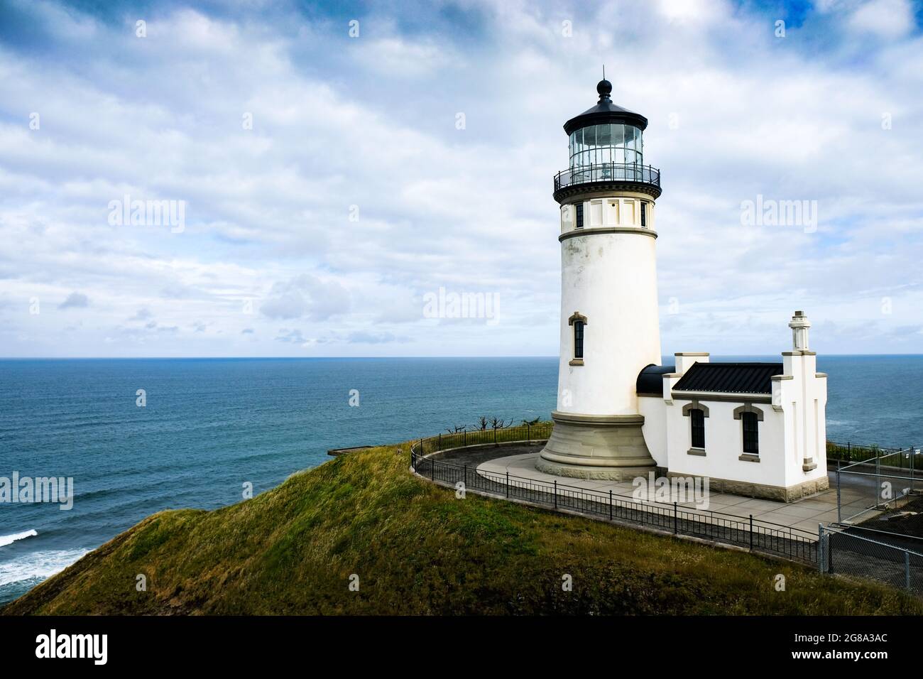 Beautiful old lighthouse, grass, Pacific Ocean and sky, coast of ...