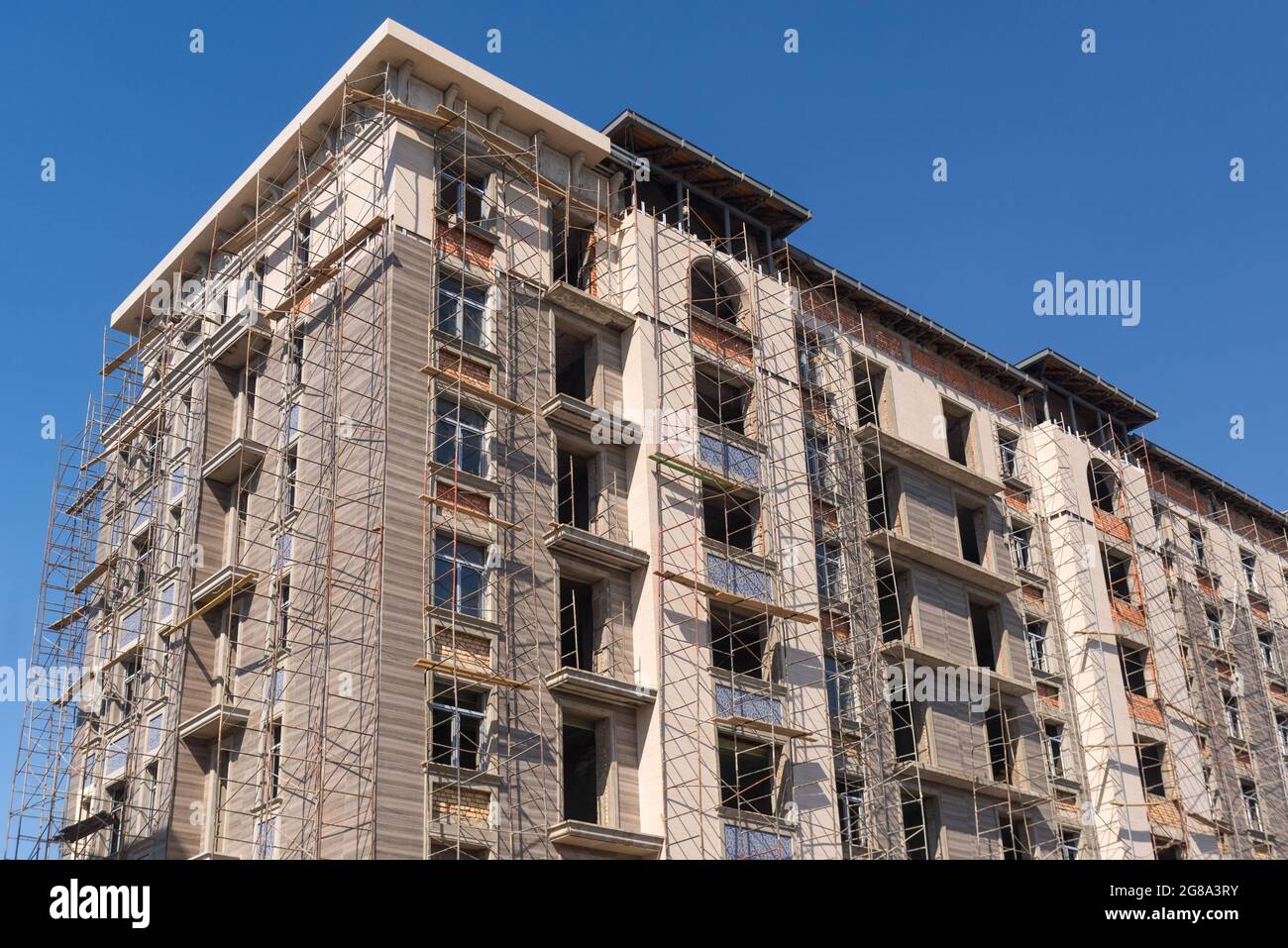 Finishing works on the facade of a new residential buildings Stock ...