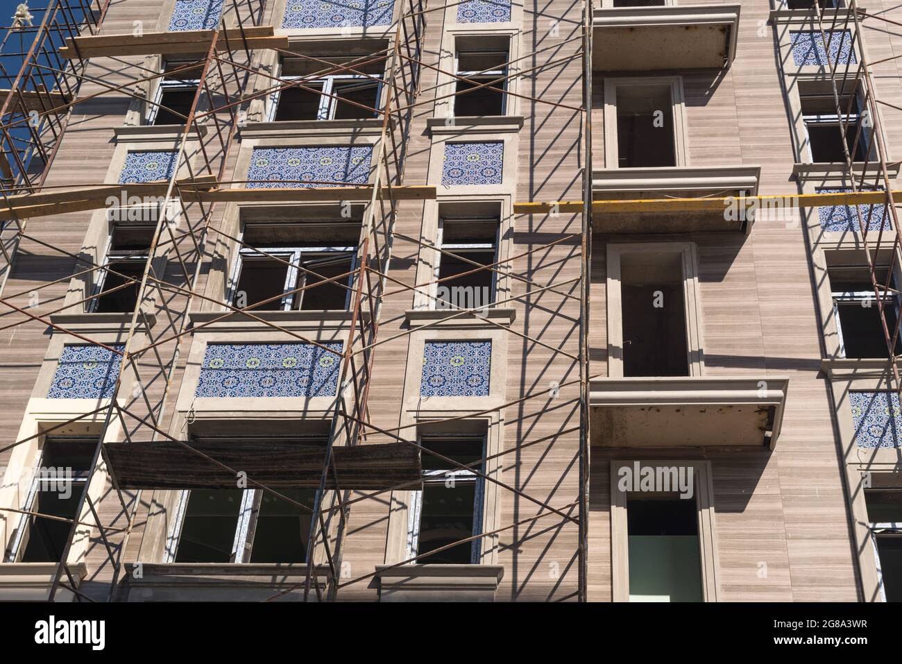 Finishing works on the facade of a new residential buildings Stock ...