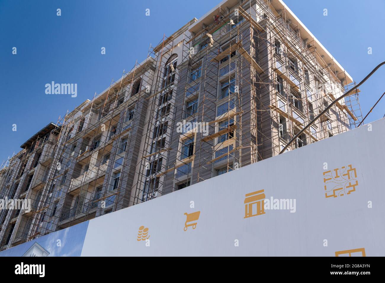 Finishing works on the facade of a new residential buildings Stock ...