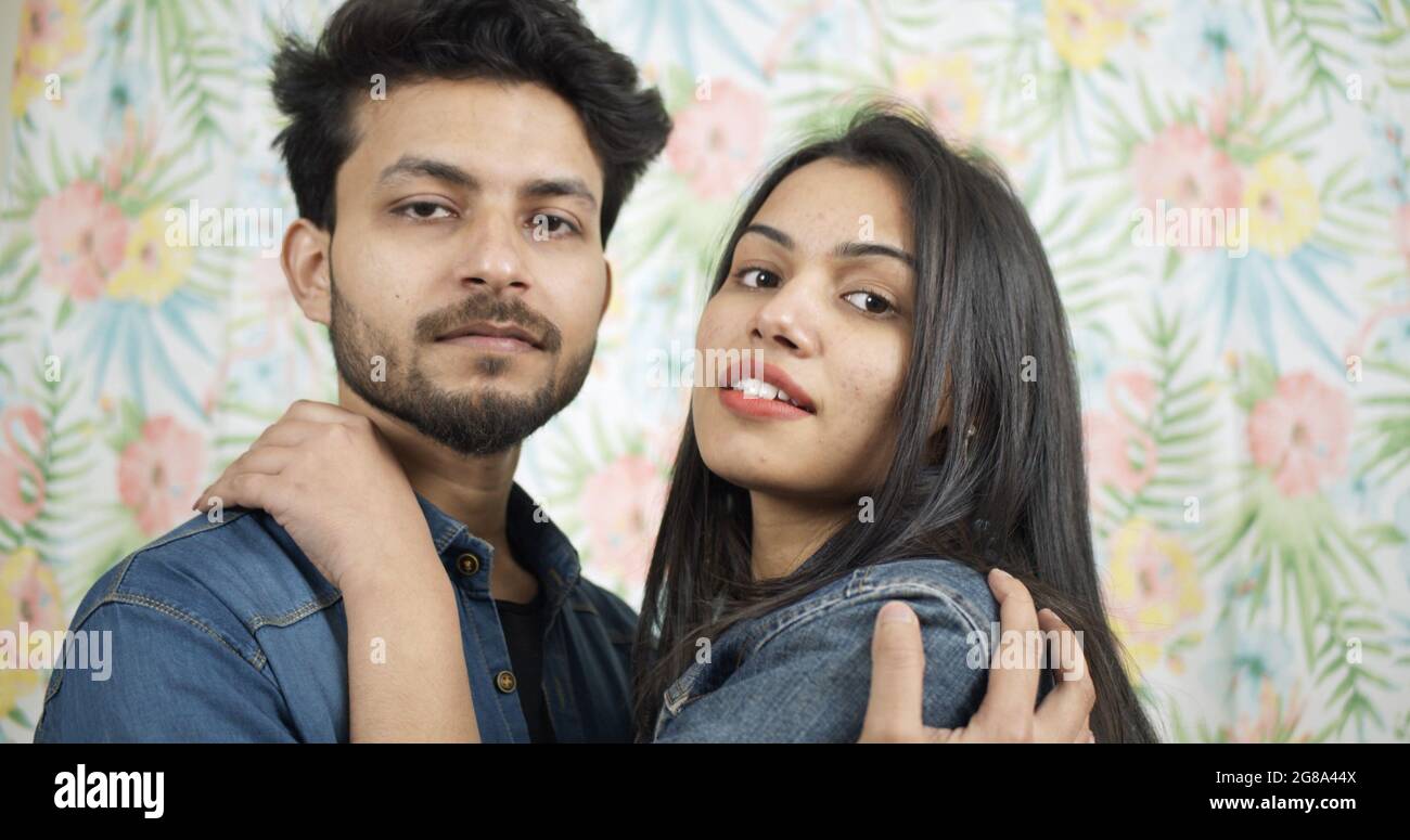 A young Indian couple posing while hugging each other at home Stock ...