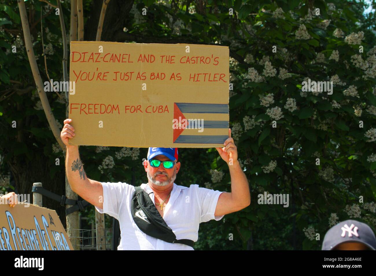 A protestor holds a placard during a demonstration in solidarity with ...