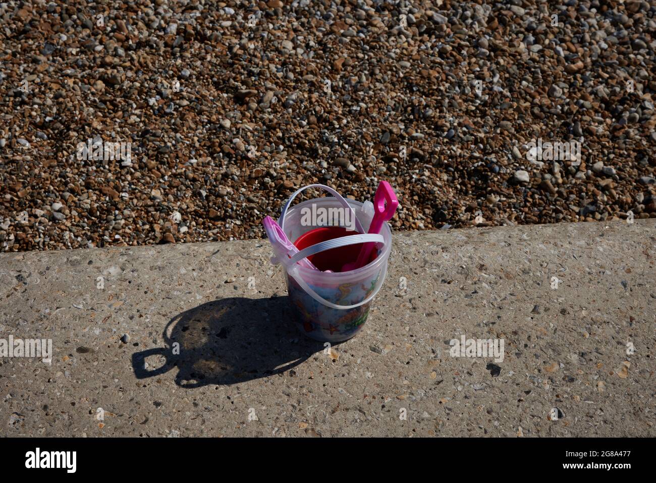 Bucket and spade seen on beach, UK Stock Photo - Alamy