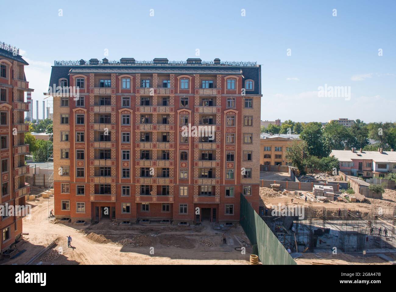 Builders on the construction site. Building under construction Stock ...