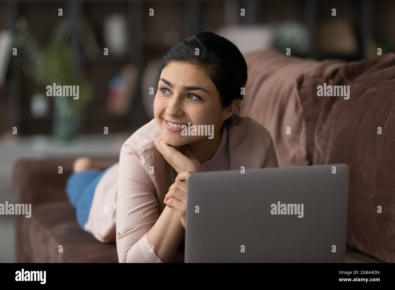 Happy Indian woman distracted form computer work planning Stock Photo ...