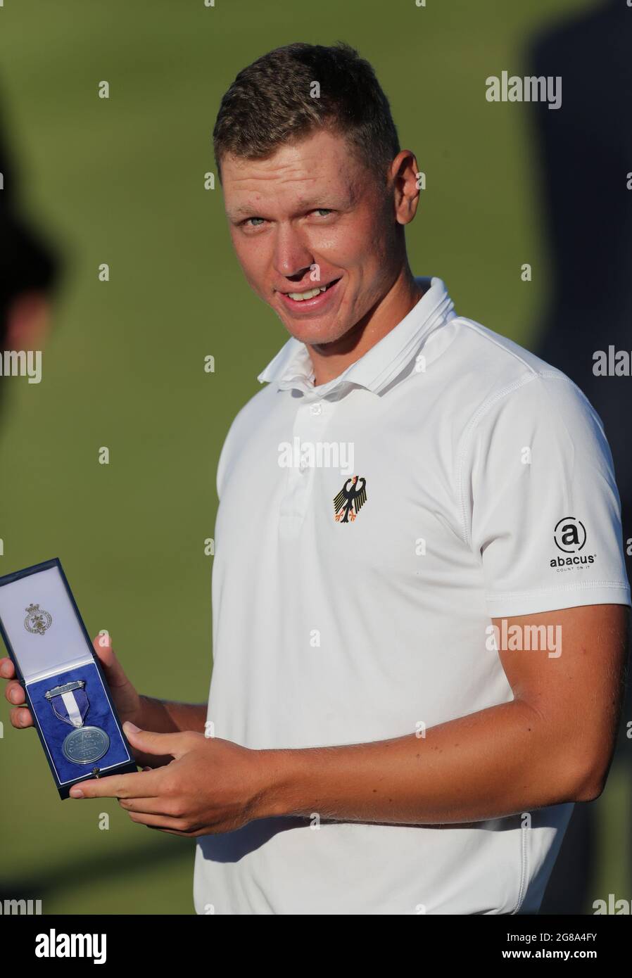 Germany's Matthias Schmid poses with his best amateur medal after day ...